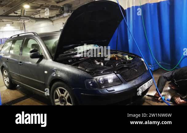 Self service car wash. Man washing his car at automobile washing ...
