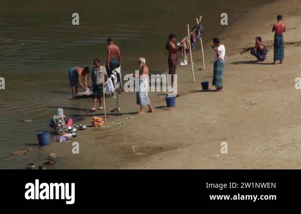 People wash clothes at Sangu river banks in Bandarban, Bangladesh Stock ...