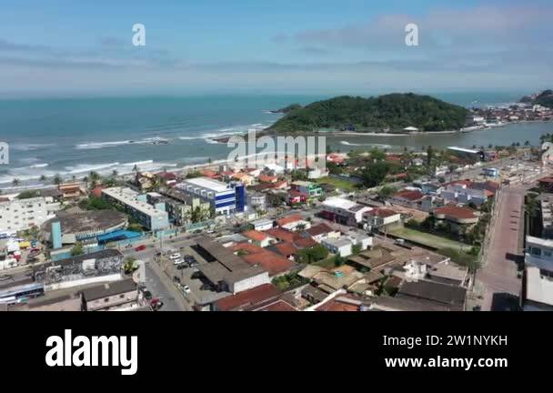 Coastal city view on the beach in a cloudy day. Beach scene. Coastal ...