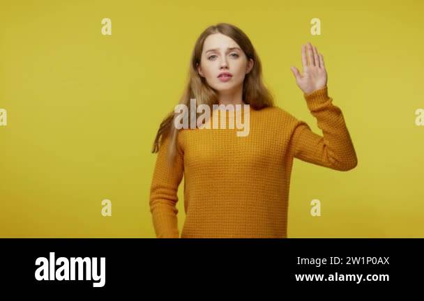 I swear! Responsible girl with sincere face expression raising hand to ...