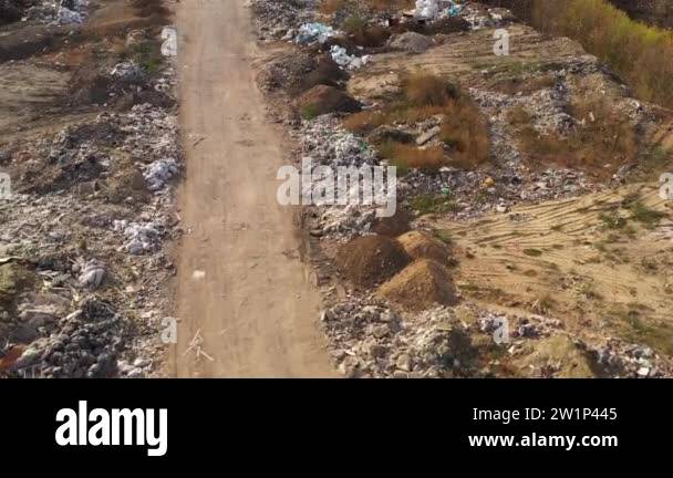 Road passing through a large landfill, aerial shot. Sanctioned landfill ...