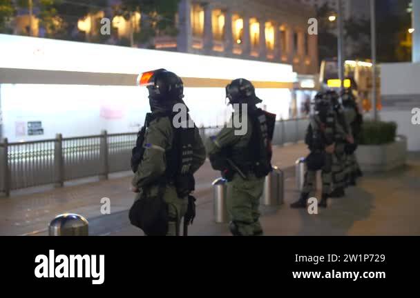 Police Special Forces Members Guard Hong Kong Watching Buses Drive by ...
