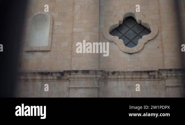 Close up view of cross in front of the catholic church entrance, rack ...