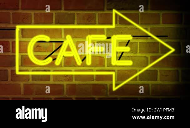 Neon cafe sign above restaurant shows diner with food available ...