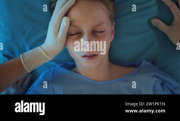 Close up of paramedics putting on child face oxygen inhalation mask ...