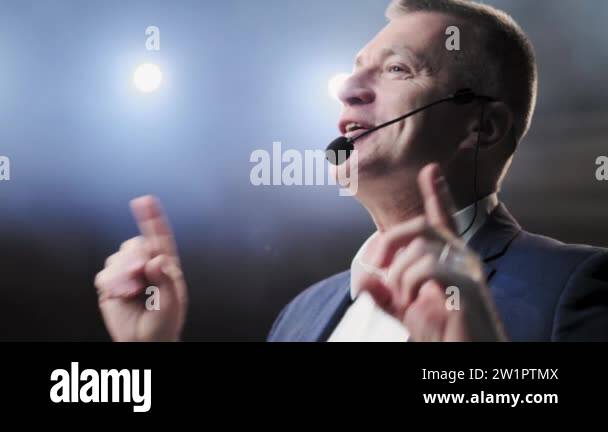 Showman. Middle Age Male entertainer, presenter or actor on stage. Arms ...