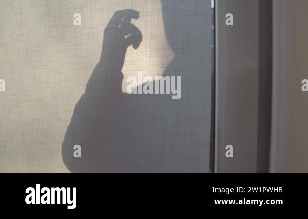 Close-up of entrance door with male silhouette knocking. Female ...