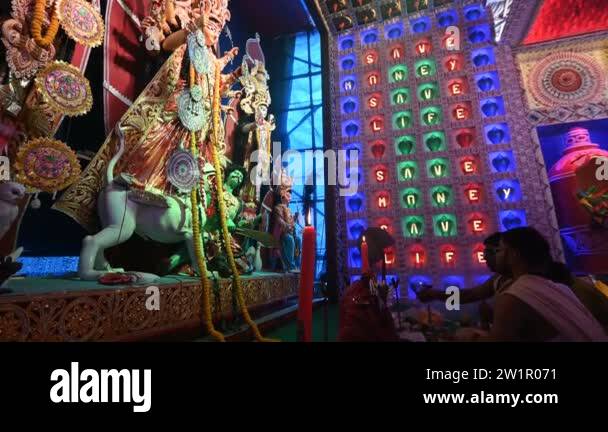 Howrah, West Bengal, India - 5th October 2019 : Hindu Bengali priests chanting Sanskrit shlokas ...