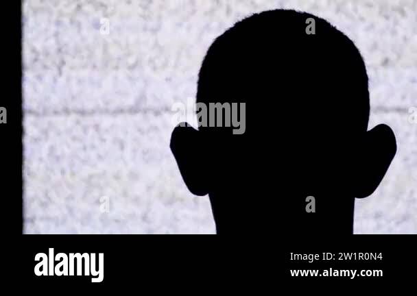Silhouette of an Anonymous Mans Head is Watching White Static Noise and ...