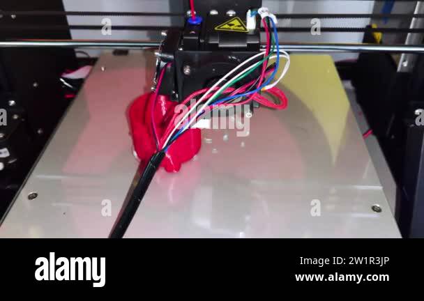 A modern 3D printer at work. Macro photography of a CNC machine that ...