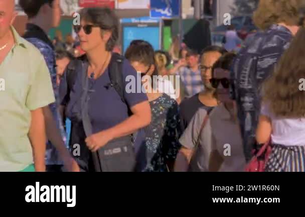 Mass of people walking in the city. Urban people going at a busy city ...