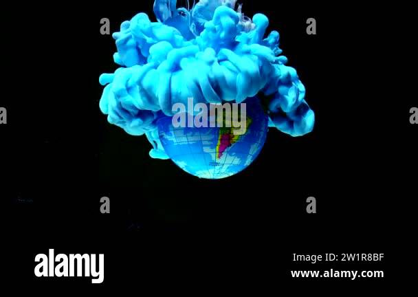 Blue planet earth from space. Blue watercolor ink in water on a black ...