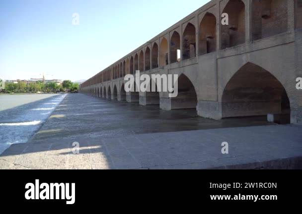 Isfahan, Iran - May 2019: Zayandeh river flowing under SioSe Pol or ...