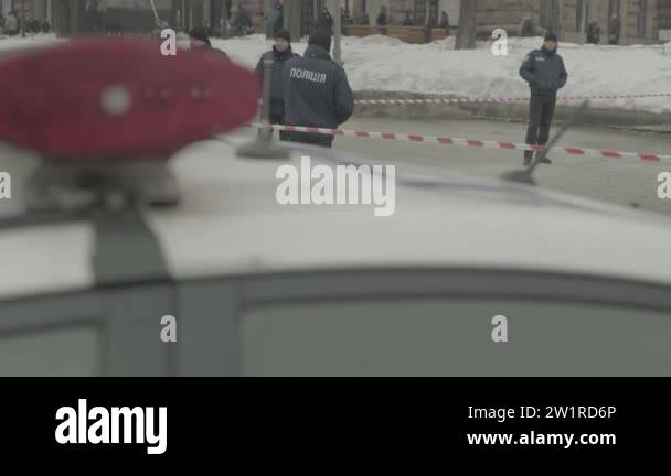 Police officers at the crime scene. Flashing police flasher. Kyiv ...