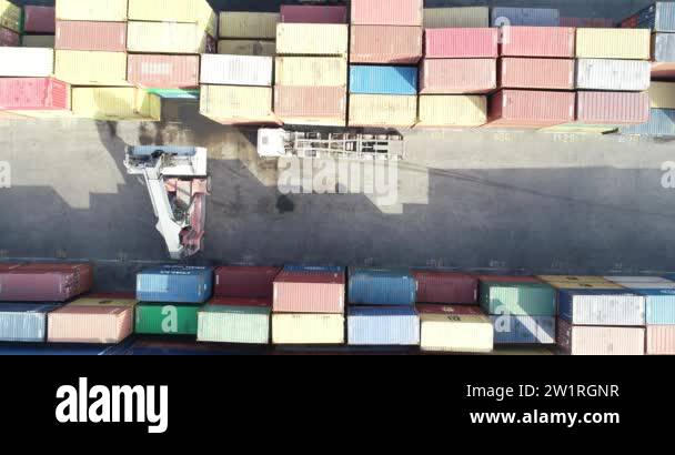 Container Handler Loading a Truck in Port Terminal. Transportation of ...