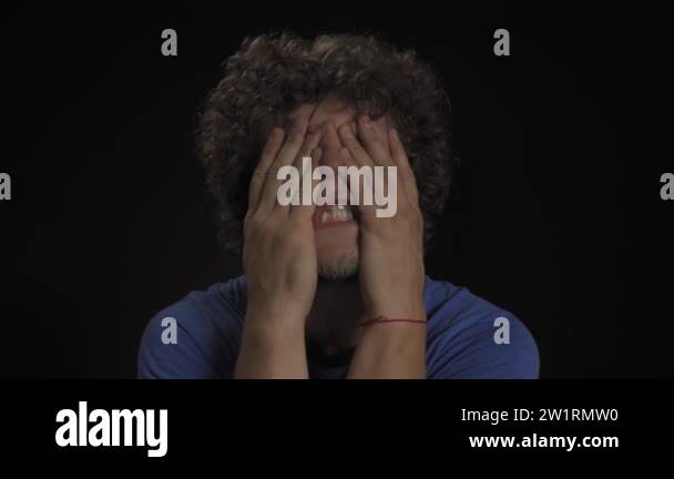 Young artistic guy depicts the emotion of embittered fatigue. Hes fed ...