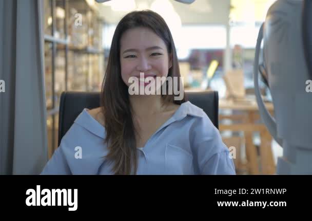 Optical shop concept. Asian patients are measuring their eyesight using specialized machines. 4k ...