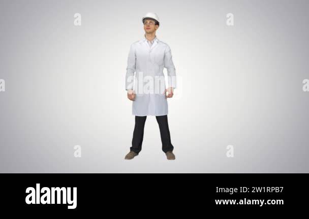 Scientist Engineer in white robe, safety helmet and glasses Making ...