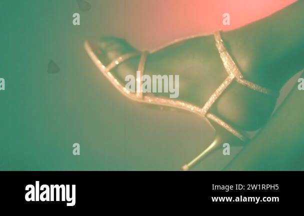 motion of feet in stockings and shiny shoes in vintage style on red ...