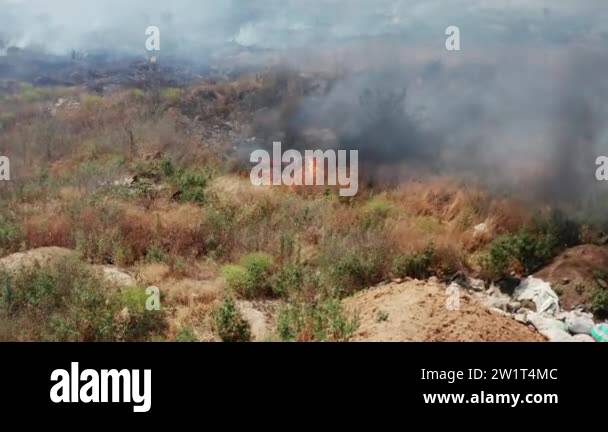 Illegal burning of household waste, garbage. Fire, fumes and cloud of ...