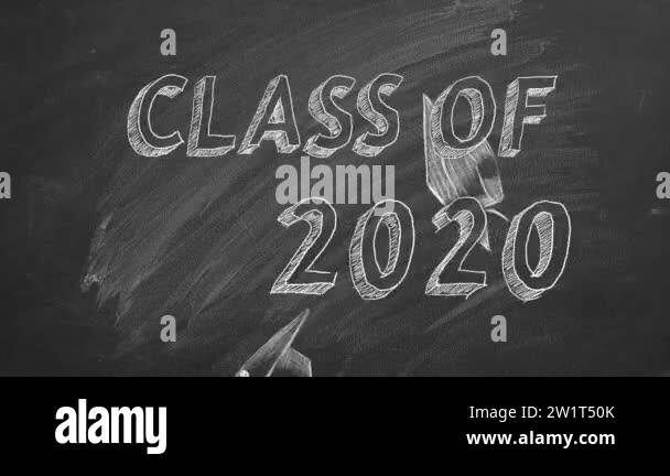 Hand drawing "Class of 2020" and graduation caps on blackboard Stock ...