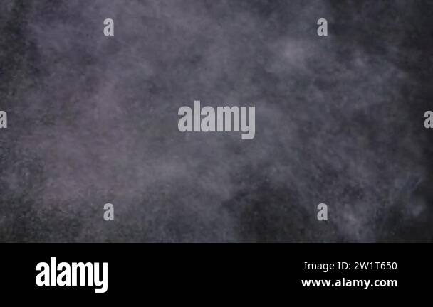Floating dust on a black smoky background. Cinematic dust for film ...