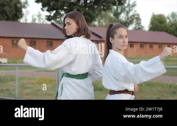 Female athletes in karate training show basic stances in technique ...