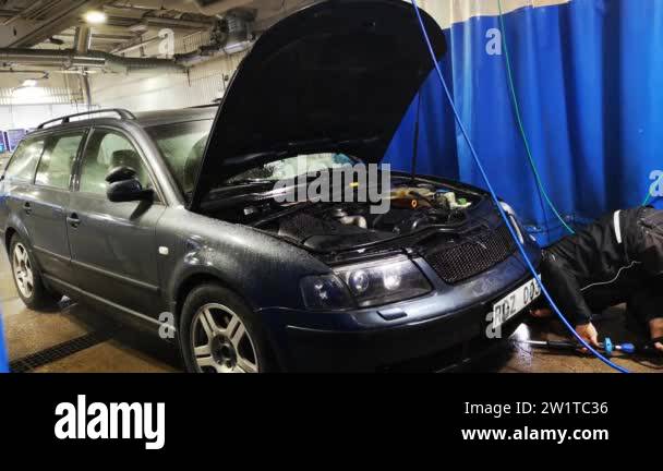 Self service car wash. Man washing his car at automobile washing ...