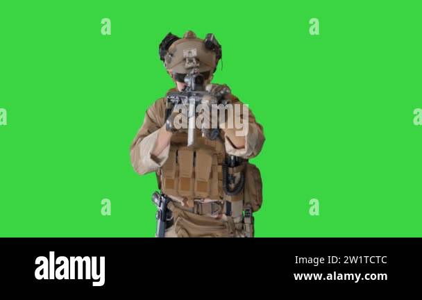 Soldier shoots aming and shooting with rifle on a Green Screen, Chroma ...
