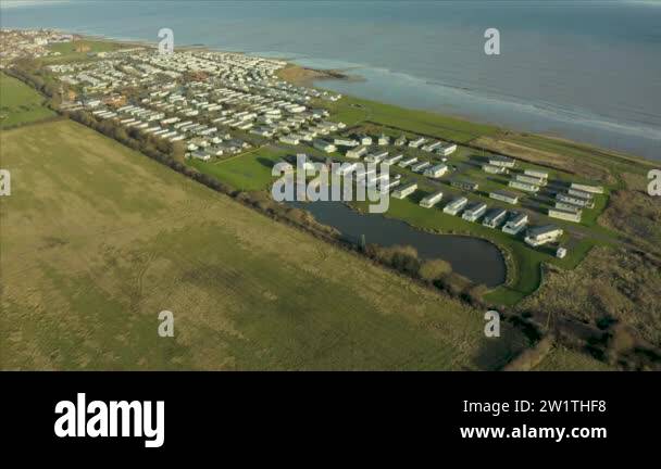 Aerial footage of stationary caravan holiday homes in a trailer park ...