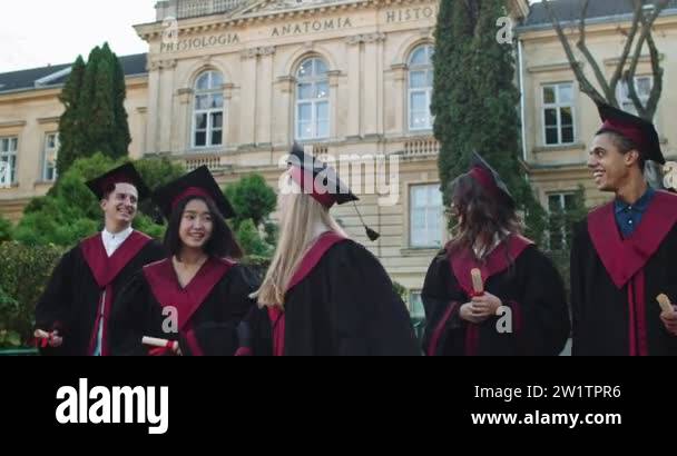 Young mixed-races joyful and happy girls and guys, graduated students ...