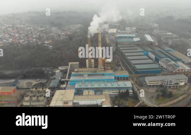 Factory chimney producing Heavy air pollution by burning fossil fuels ...