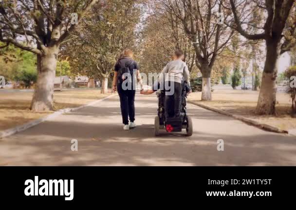 wheelchair man. Handicapped man. young disabled man in an automated ...