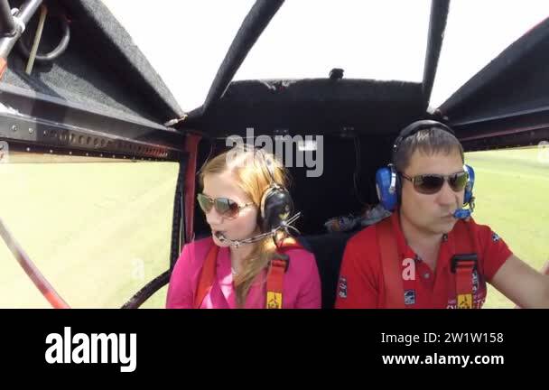 The pilot and passenger, small aircraft. Panoramic flight. The camera ...