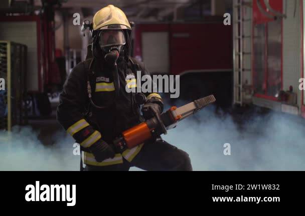 firefighter portrait wearing full equipment, oxygen mask, and power ...