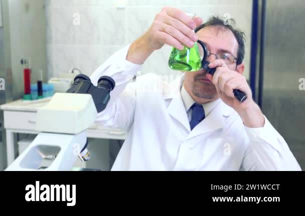 Chemist crazy. A mad scientist conducts experiments in a scientific ...