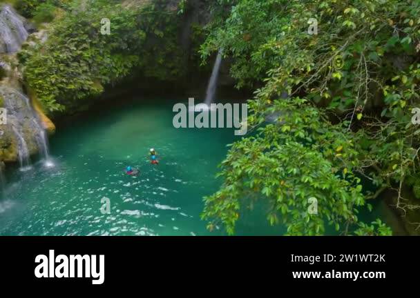 Kawasan Falls on Cebu Island, Philippines. People swimming at the ...