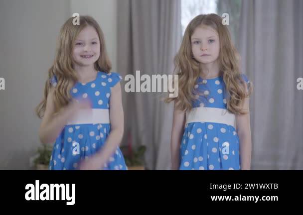 Two identical twin sisters with different temperament types posing at ...