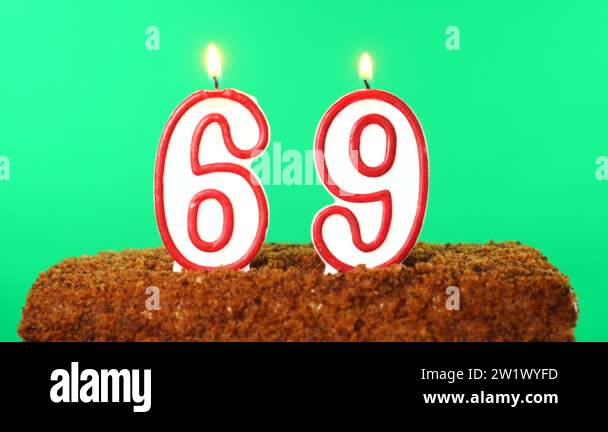 Cake with the number 69 lighted candle. Chroma key. Green Screen ...