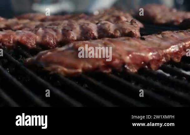 Large electric rotating grill for cooking ribs. The ribs rotate and are ...