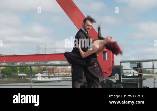 Sexy woman dancer bending over with suggestive moves while dancing with ...