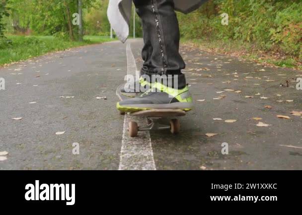 person legs feet skateboard city road closeup teenager stand deck board ...