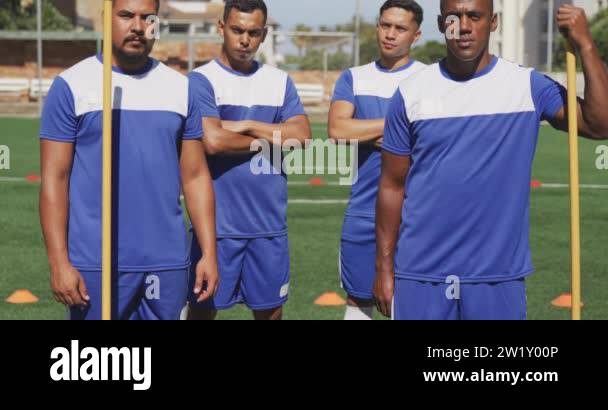 Front view of a multi-ethnic group of male football players wearing a ...