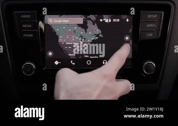 Close up mans hand using a map in Skoda Rapid automobile. Google maps ...