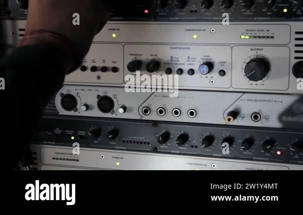 A rack of audio compressors and other components of sound reinforcement ...