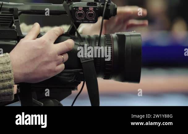 Cameraman with a camera in wrestling competitions. Close-up Stock Video ...