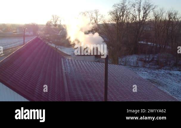 Environmental pollution, poor ecology. Smoke from the pipe from heating ...