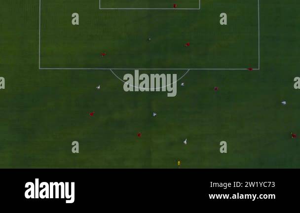 Green football stadium field. Aerial top view. Soccer players in game ...