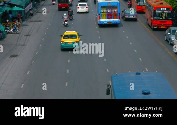 BANGKOK. THAILAND - CIRCA FEB 2015: Typical urban traffic on a central road in downtown Bangkok ...
