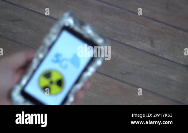 5g network danger concept. Man putting a smartphone to his ear. Back ...